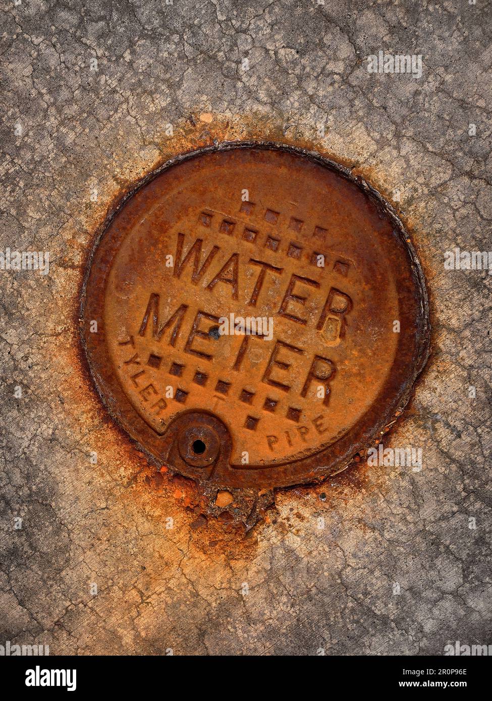 Detail of weathered rusted water meter cover texture Stock Photo - Alamy