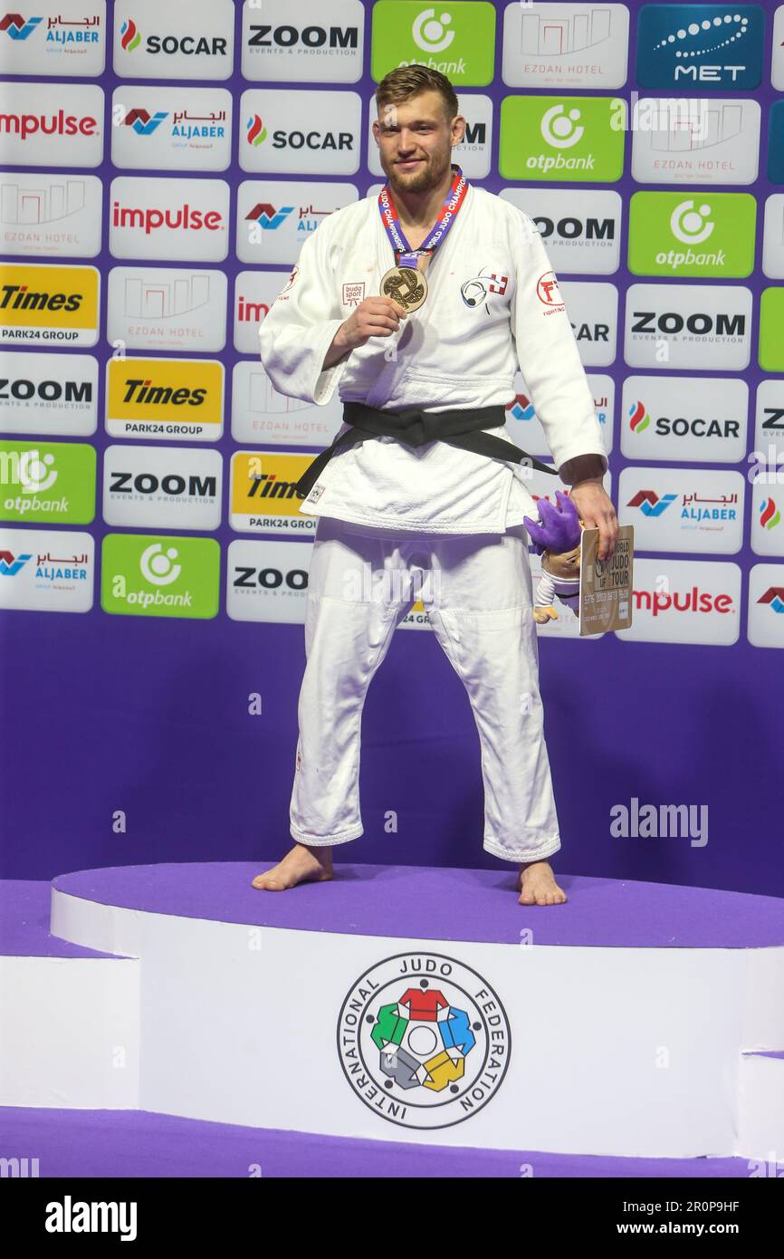 Gold medalist Nils Stump of Switzerland poses during the medal ceremony ...