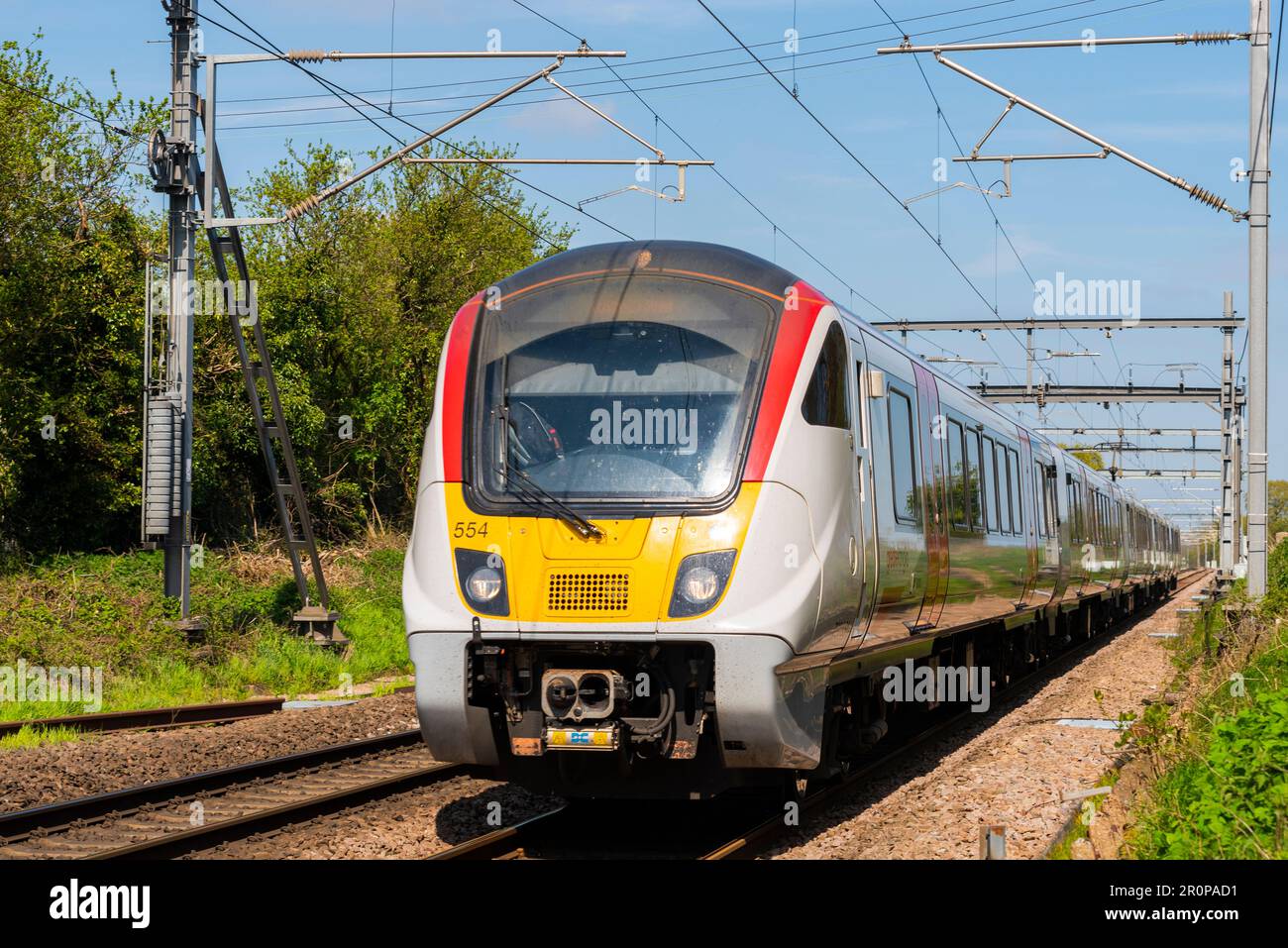 British Rail Class 720 Aventra railway train of Greater Anglia passing through Margaretting ...
