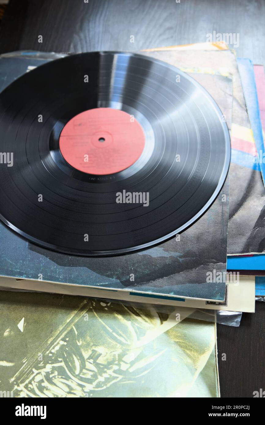 Vinyl recording disk and different albums with plates Stock Photo - Alamy