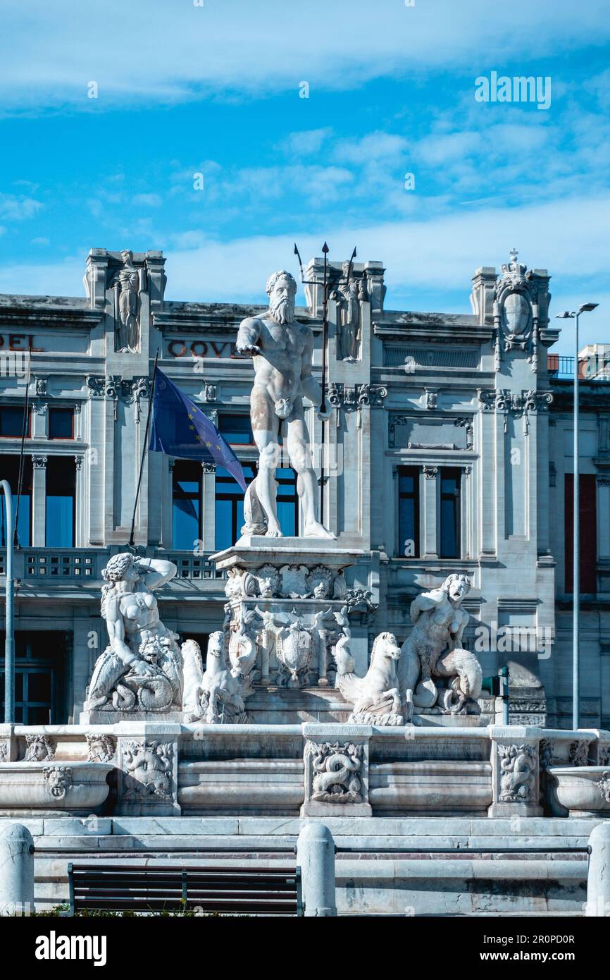 A bronze statue of three individuals standing side-by-side in a unified ...
