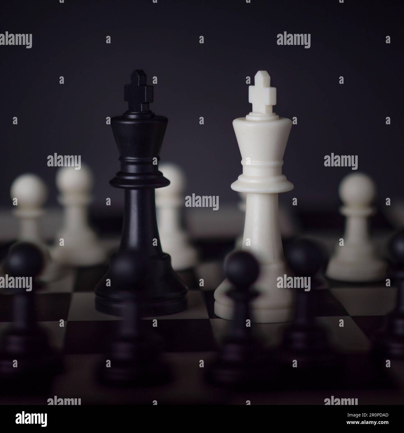 chessmen on chessboard showing race relations metaphor Stock Photo - Alamy