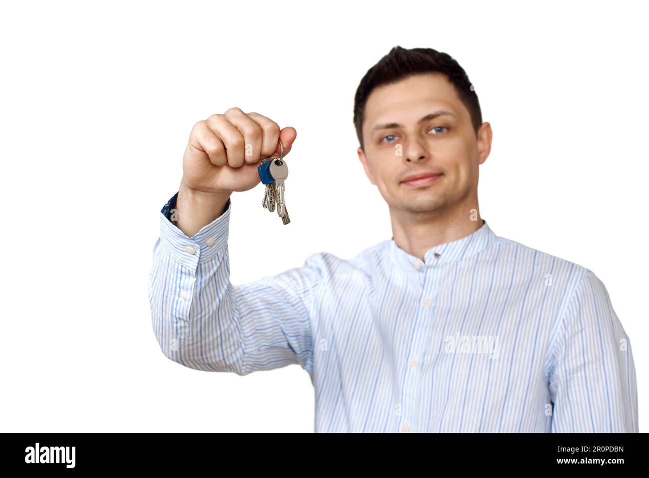 caucasian man holding keys on white background Stock Photo - Alamy