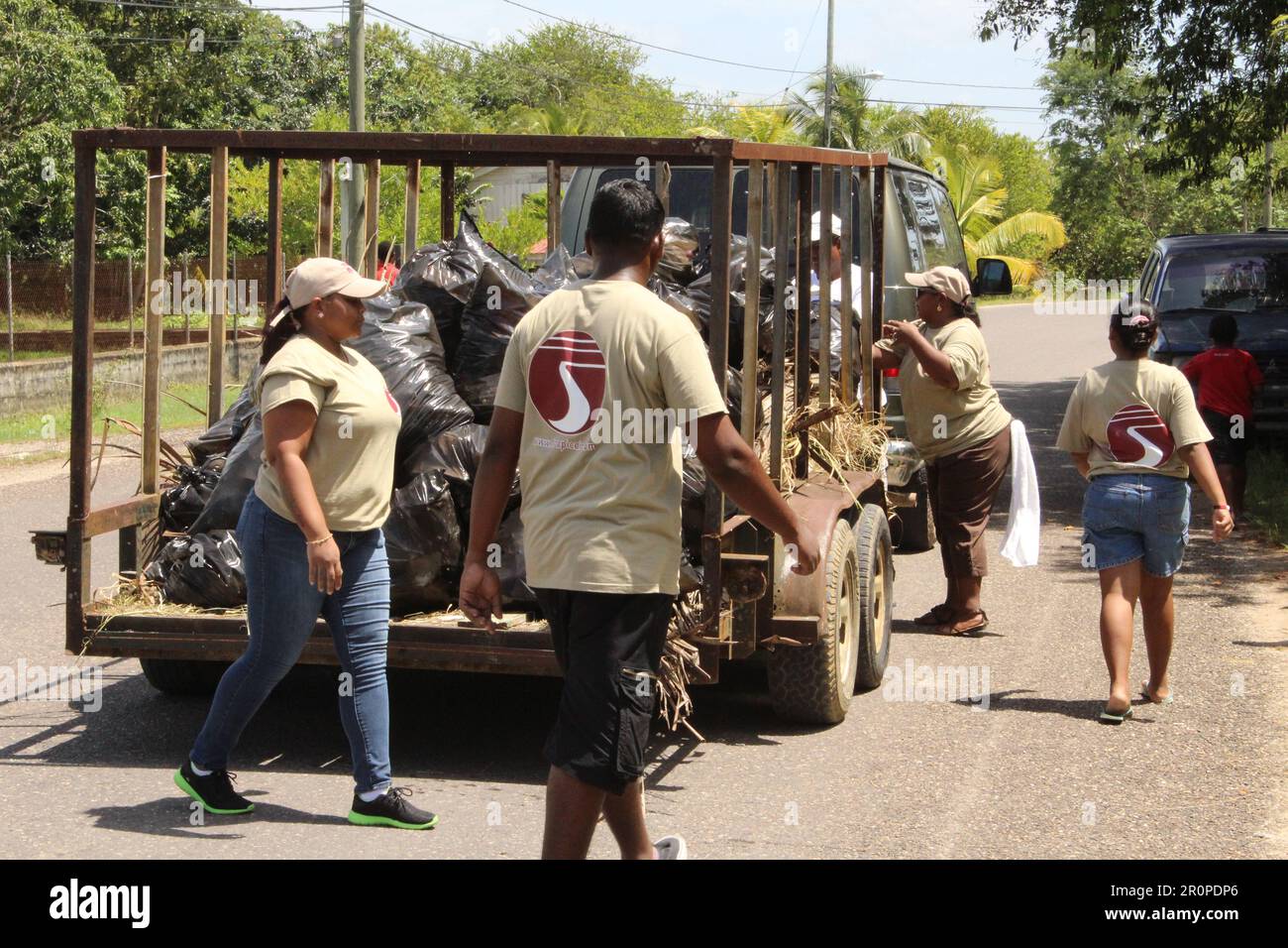 PUNTA GORDA, BELIZE - August 22, 2015 Tropic Air staff town clean up ...