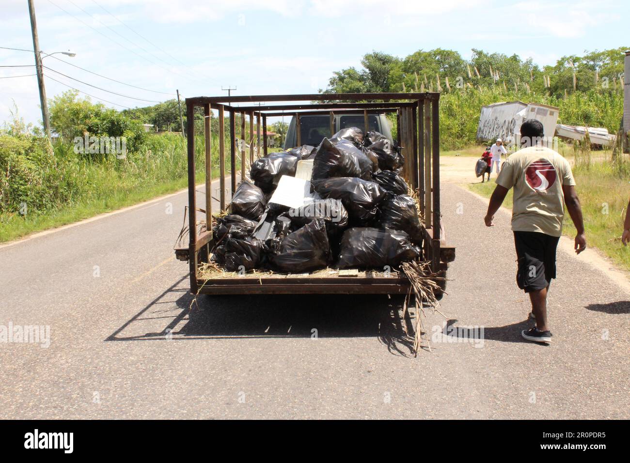PUNTA GORDA, BELIZE - August 22, 2015 Tropic Air staff town clean up ...