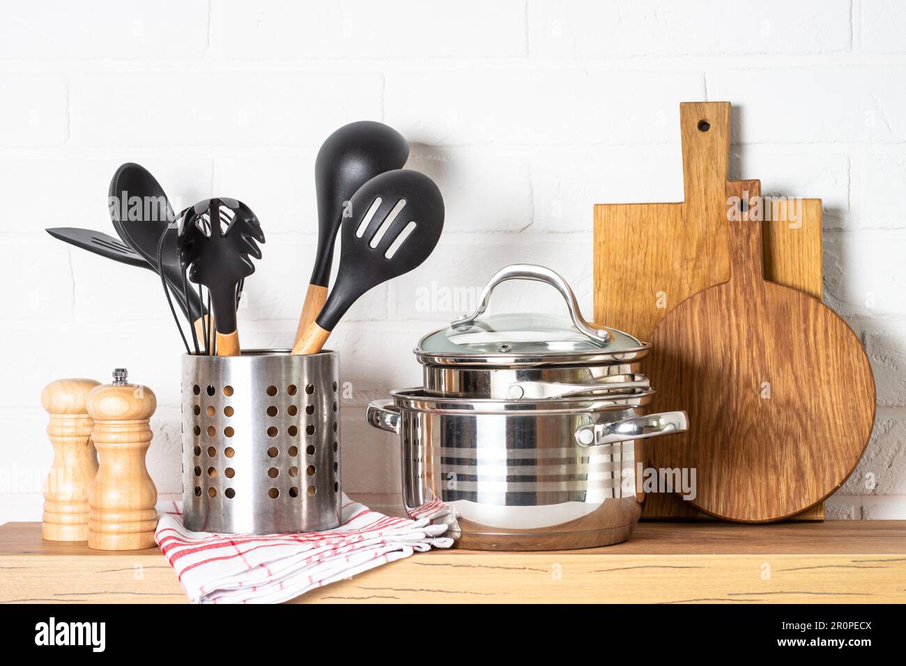 . Cooking tools with cooking pots, wooden cutting boards Stock Photo ...
