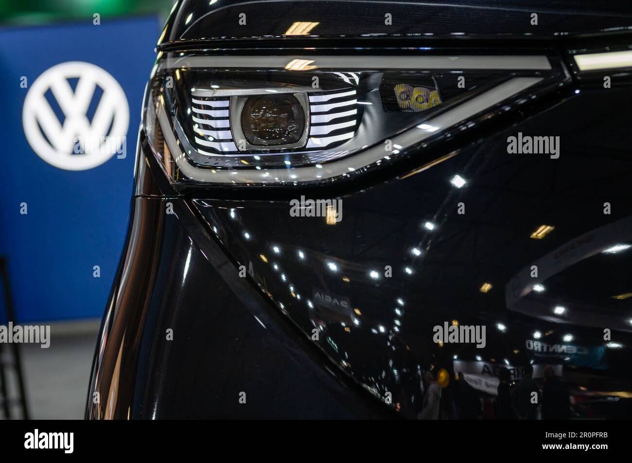 Riga, Latvia, April 28, 2023: LED headlights and car design closeup of nev Volksvagen ID. Buzz ...