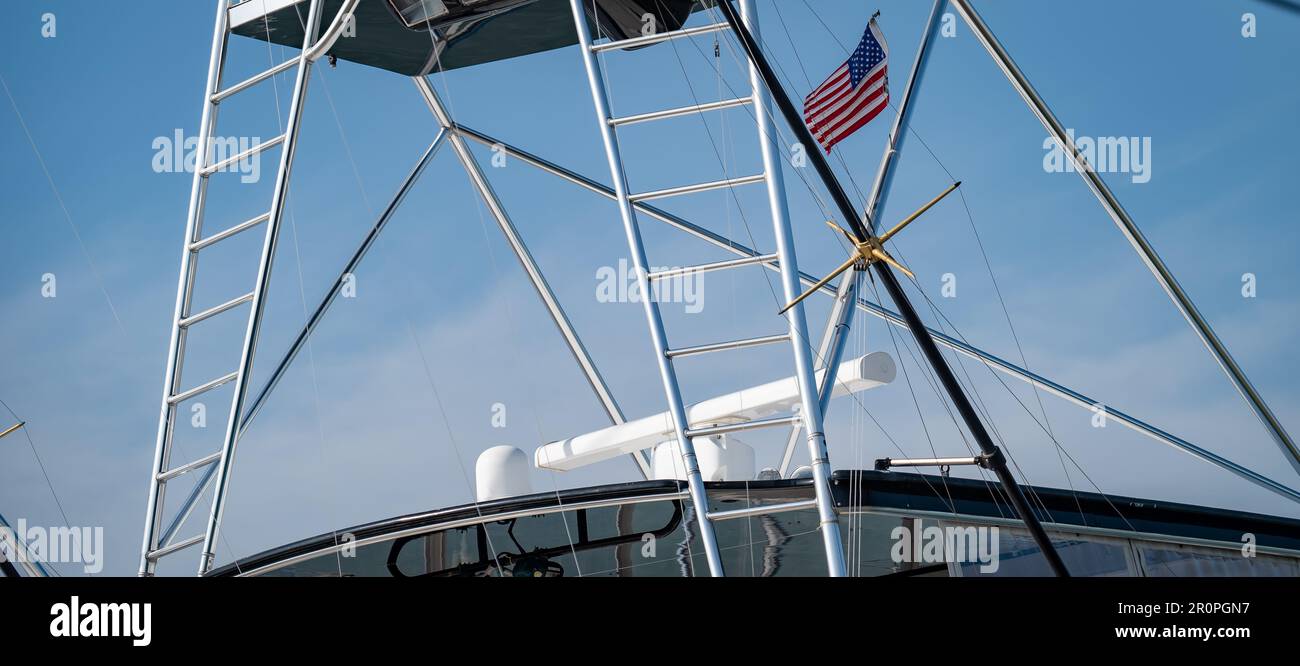 Two ladders and aluminum framework of the Tuna Tower on top of a sport ...