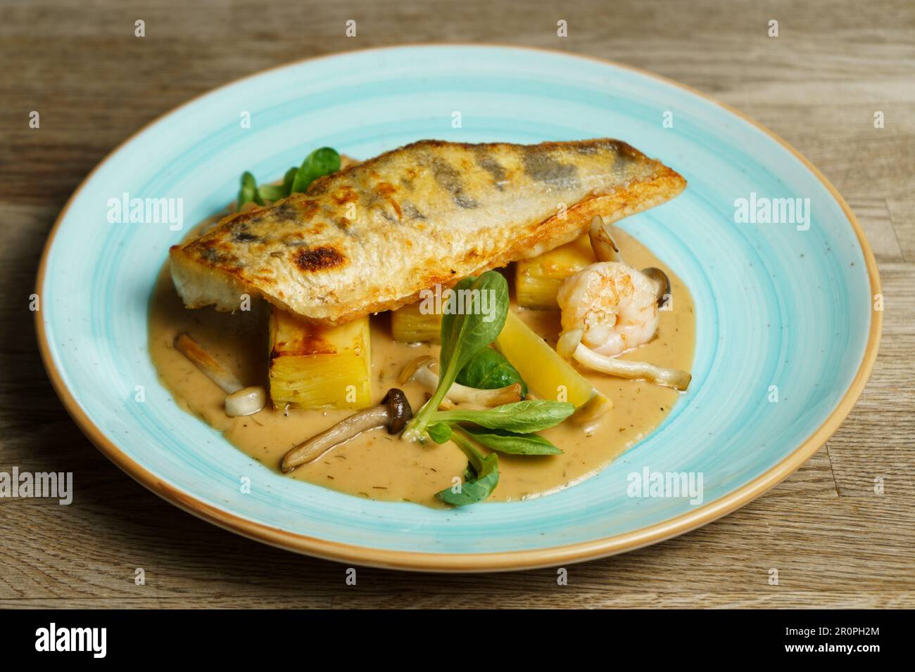 Roasted Zander fish fillet with potatoes and mushroom sauce Stock Photo ...