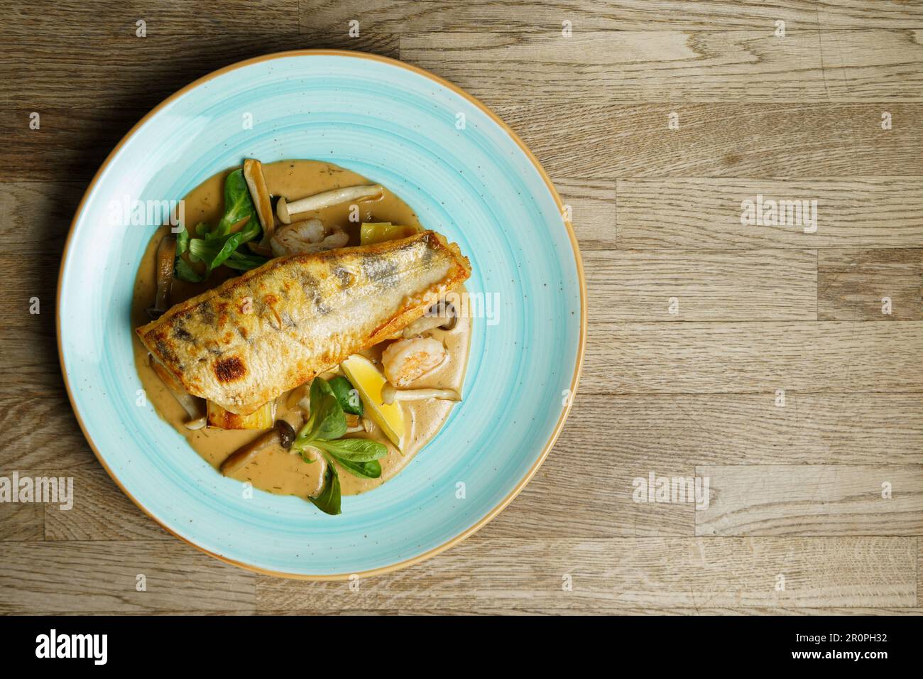 Roasted Zander fish fillet with potatoes and mushroom sauce Stock Photo ...