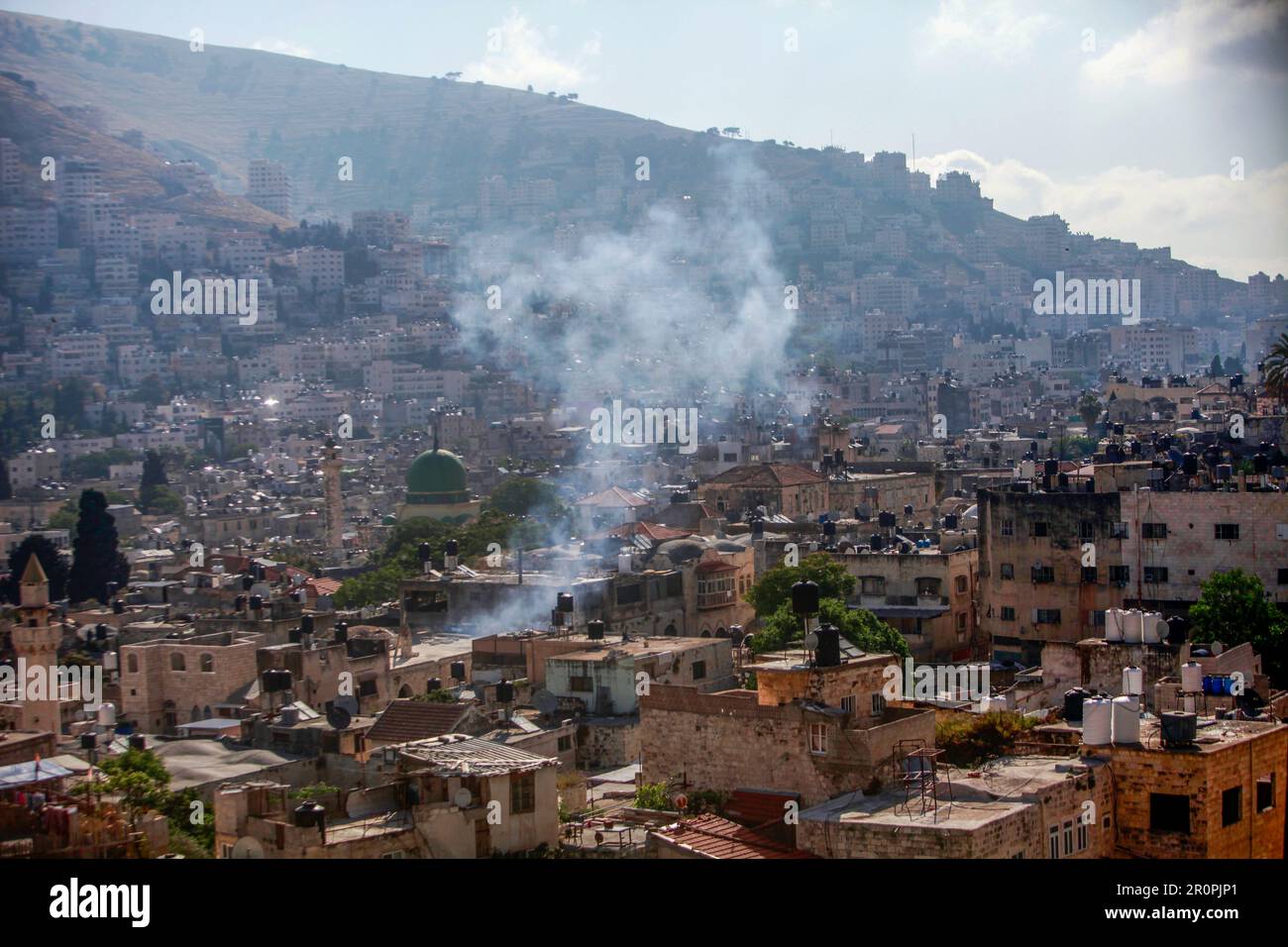 Nablus, Palestine. 09th May, 2023. Smoke rises from the old city of ...