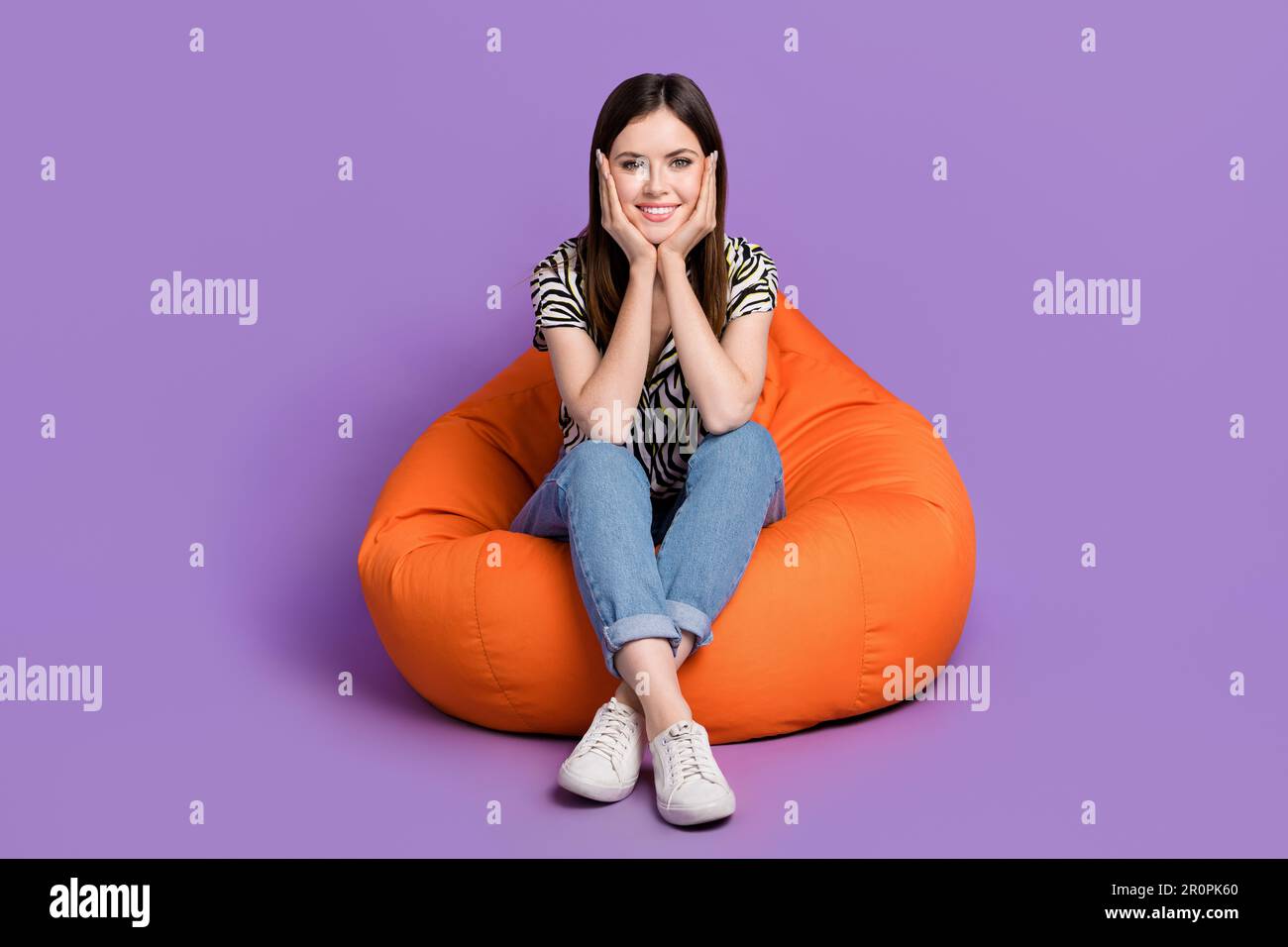 Full length portrait of satisfied peaceful person sit comfy bag hands ...
