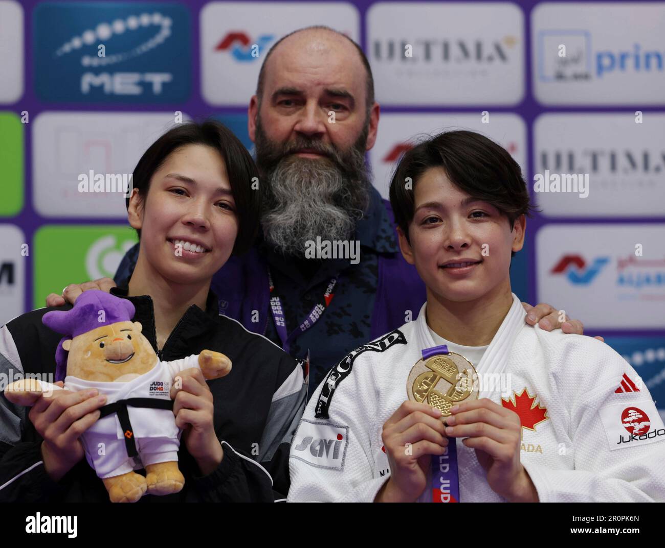 Christa Deguchi of Canada celebrates with her family during an award ...