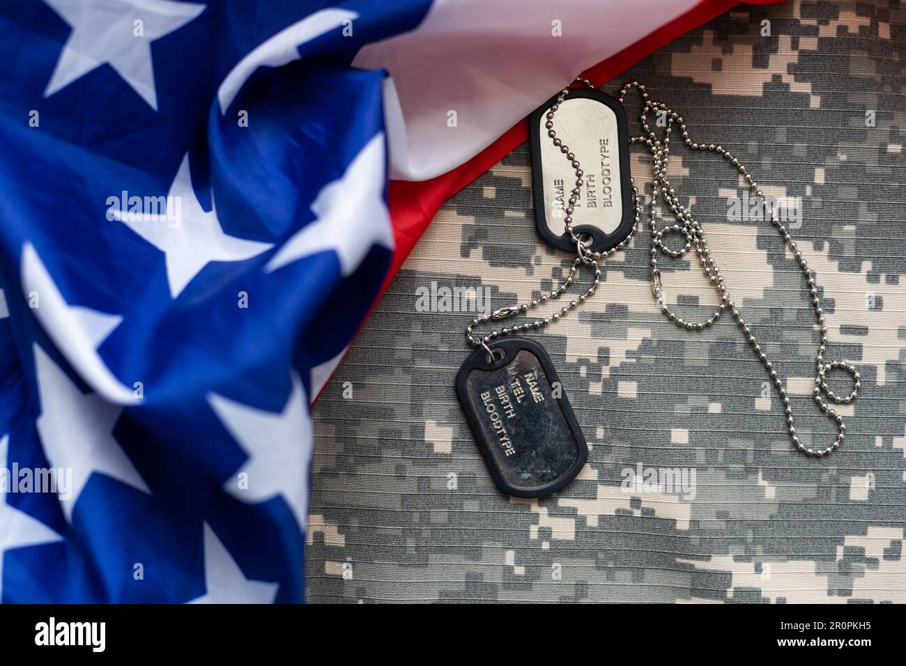 Army tokens on military uniform and USA national flag background Stock ...