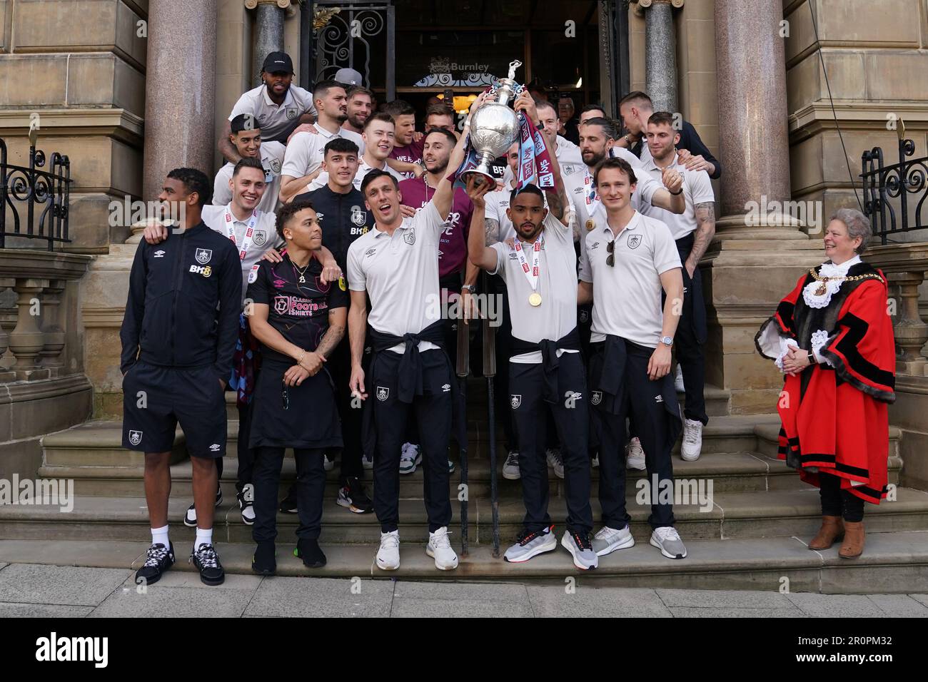 Burnley players exit Burnley town hall ahead of their open top bus ...