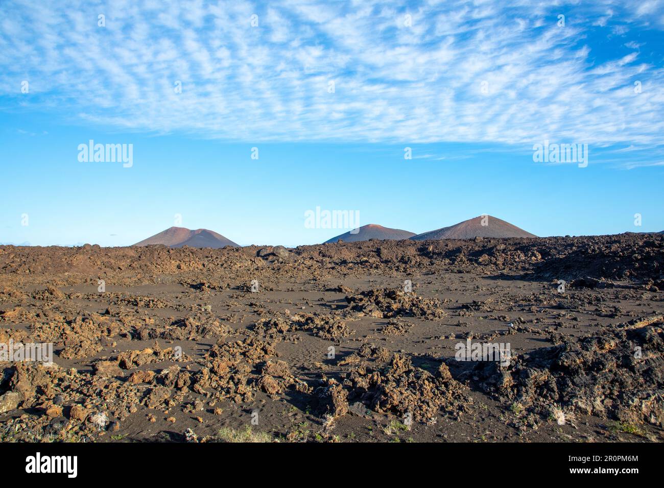 cold lava in detail in Timanfaya national park in Lanzarote with crater ...