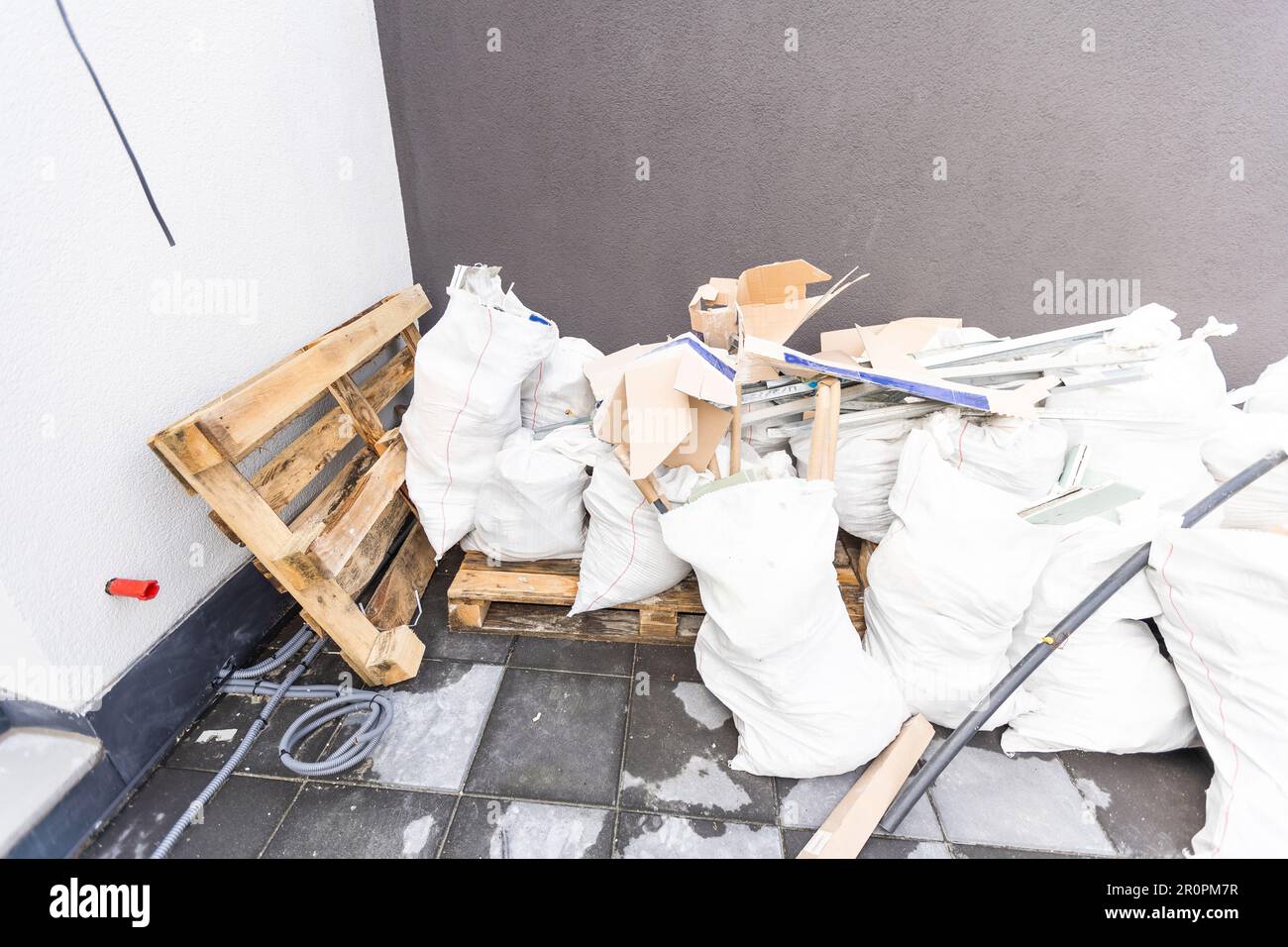 construction debris on the street near a house . Wooden window frame ...