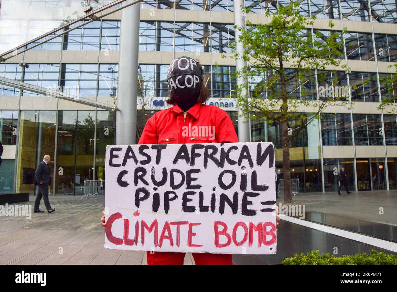 London, UK. 09th May, 2023. An activist wearing a 'Stop EACOP' mask ...