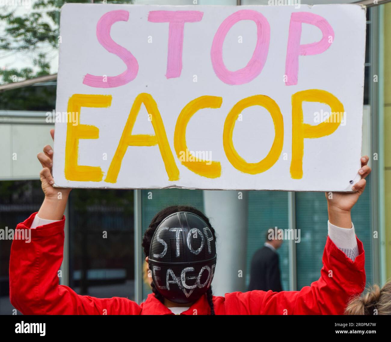 London, UK. 09th May, 2023. An activist wearing a 'Stop EACOP' mask ...