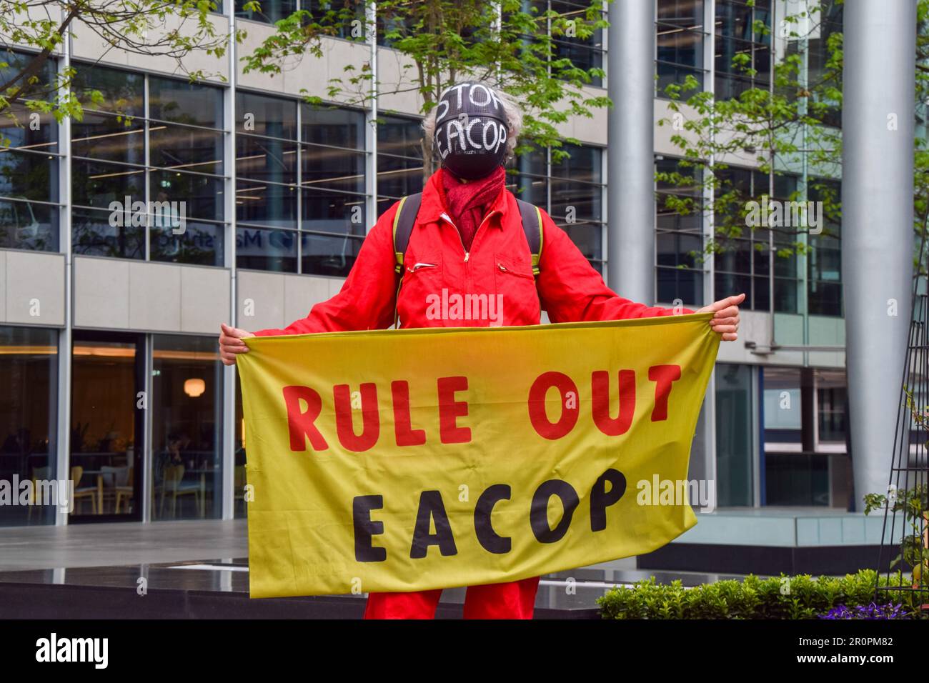London, UK. 09th May, 2023. An activist wearing a 'Stop EACOP' mask ...