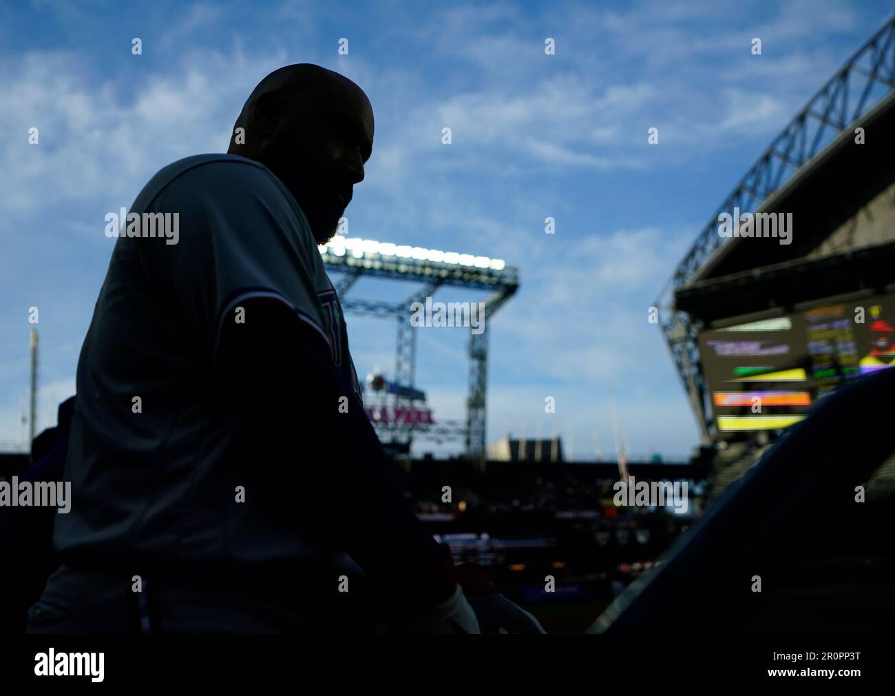 Texas Rangers' Sandy Leon looks on from the dugout before batting ...