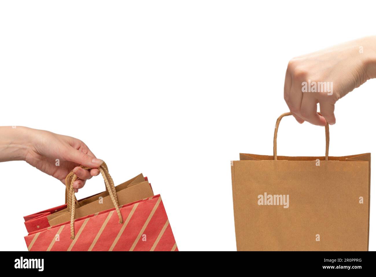 Paper bag in woman hands isolated on white background Stock Photo - Alamy