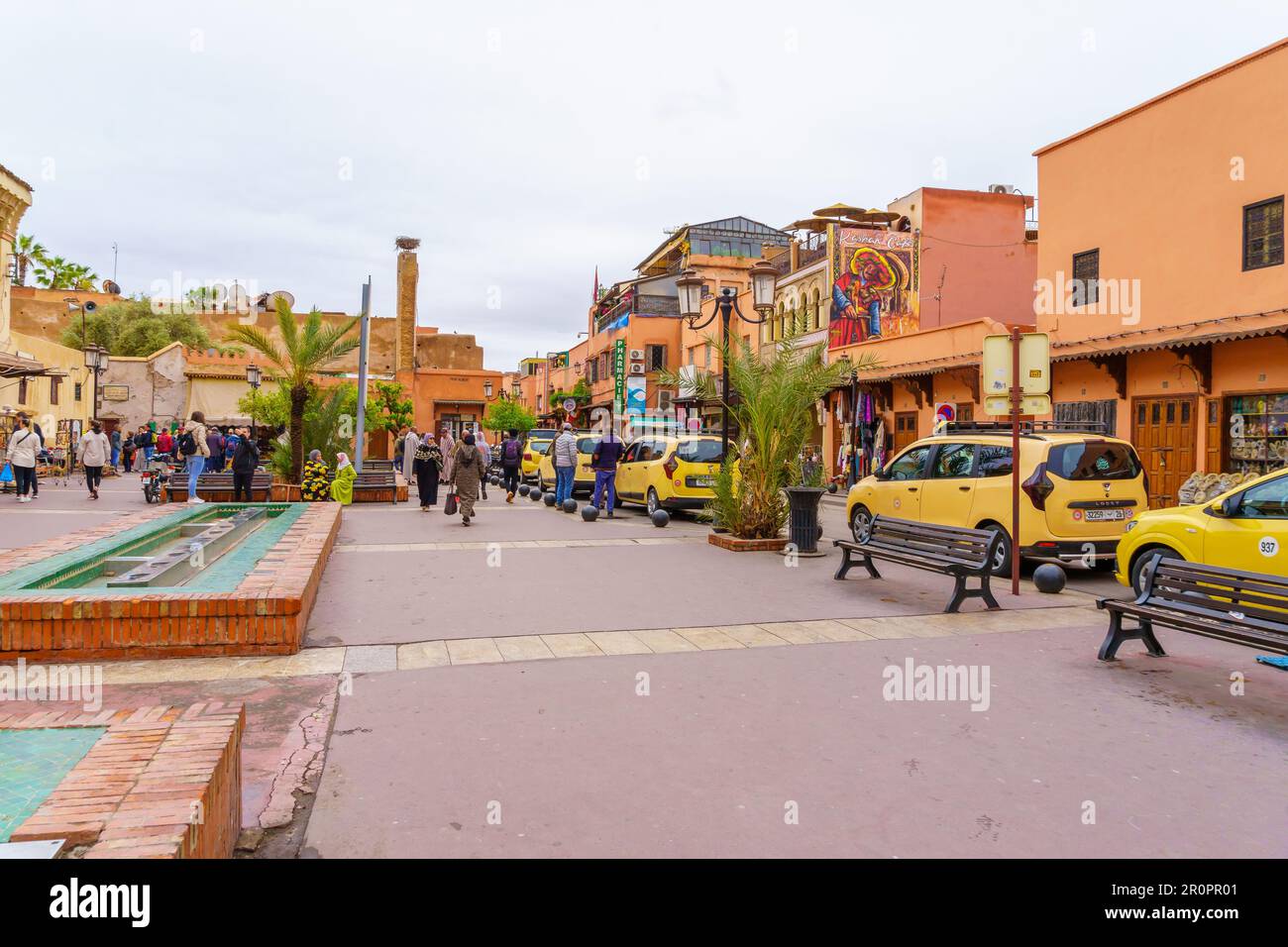 Marrakesh, Morocco - April 05, 2023: Medina street scene with taxi cars ...