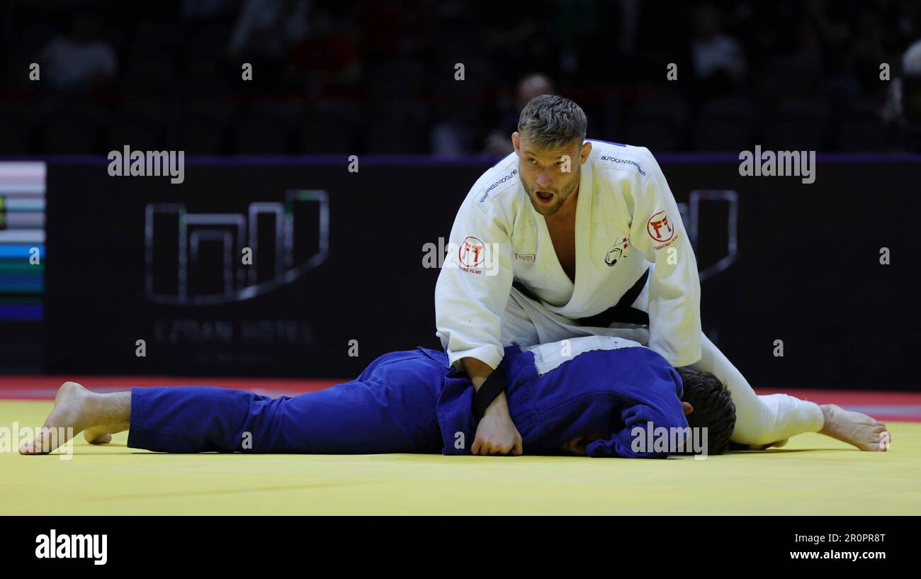 Manuel Lombardo of Italy (blue) and Nils Stump of Switzerland (white ...
