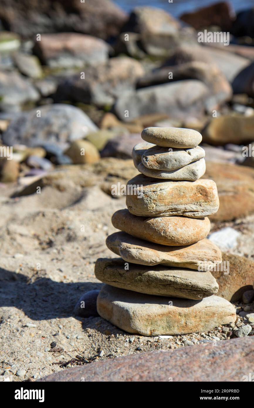 Stone tower. Natural pebble stone on the beach. Balancing body, mind ...