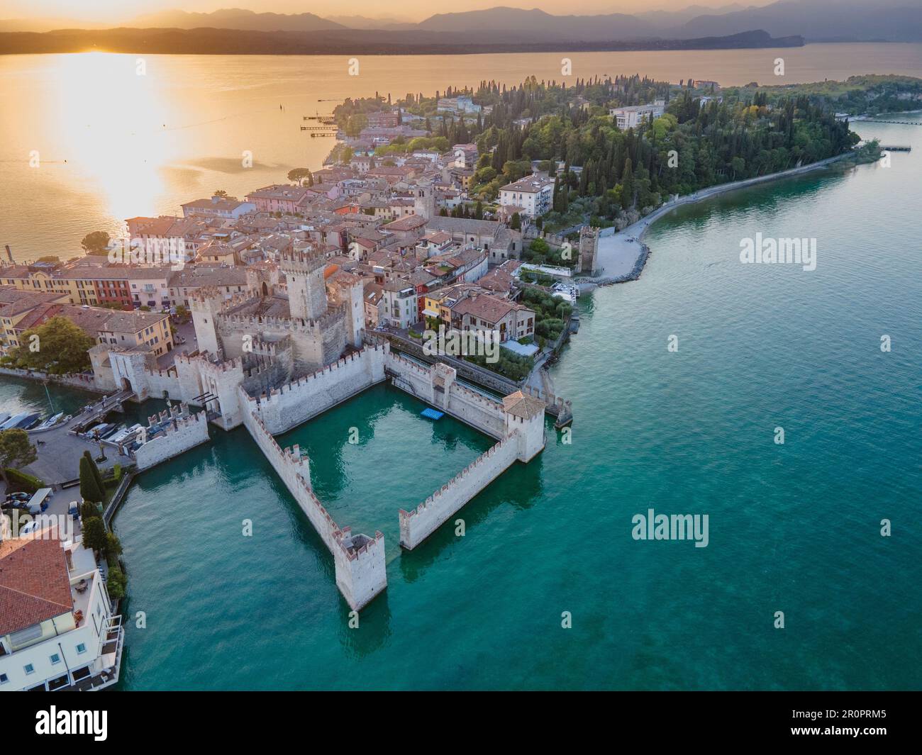 Aerial view during sunset of the medieval town of Sirmione and its ...