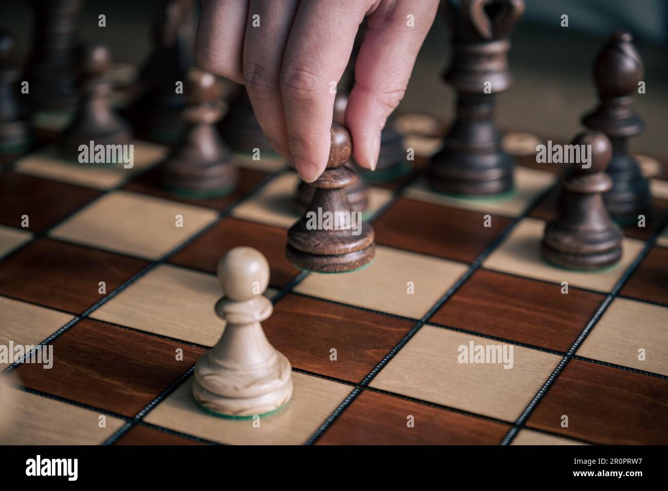 Close up of a person responding with the most common move e5 to the e4 ...