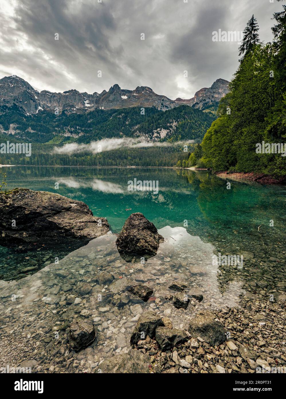 The beautiful Lake Tovel under rainy clouds in Trentino, Italy Stock ...