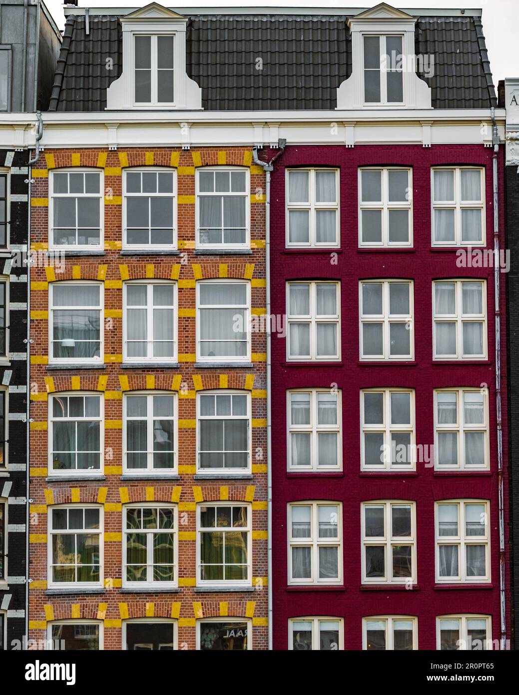 Close up of famous Amsterdam houses under the morning sky. Various ...