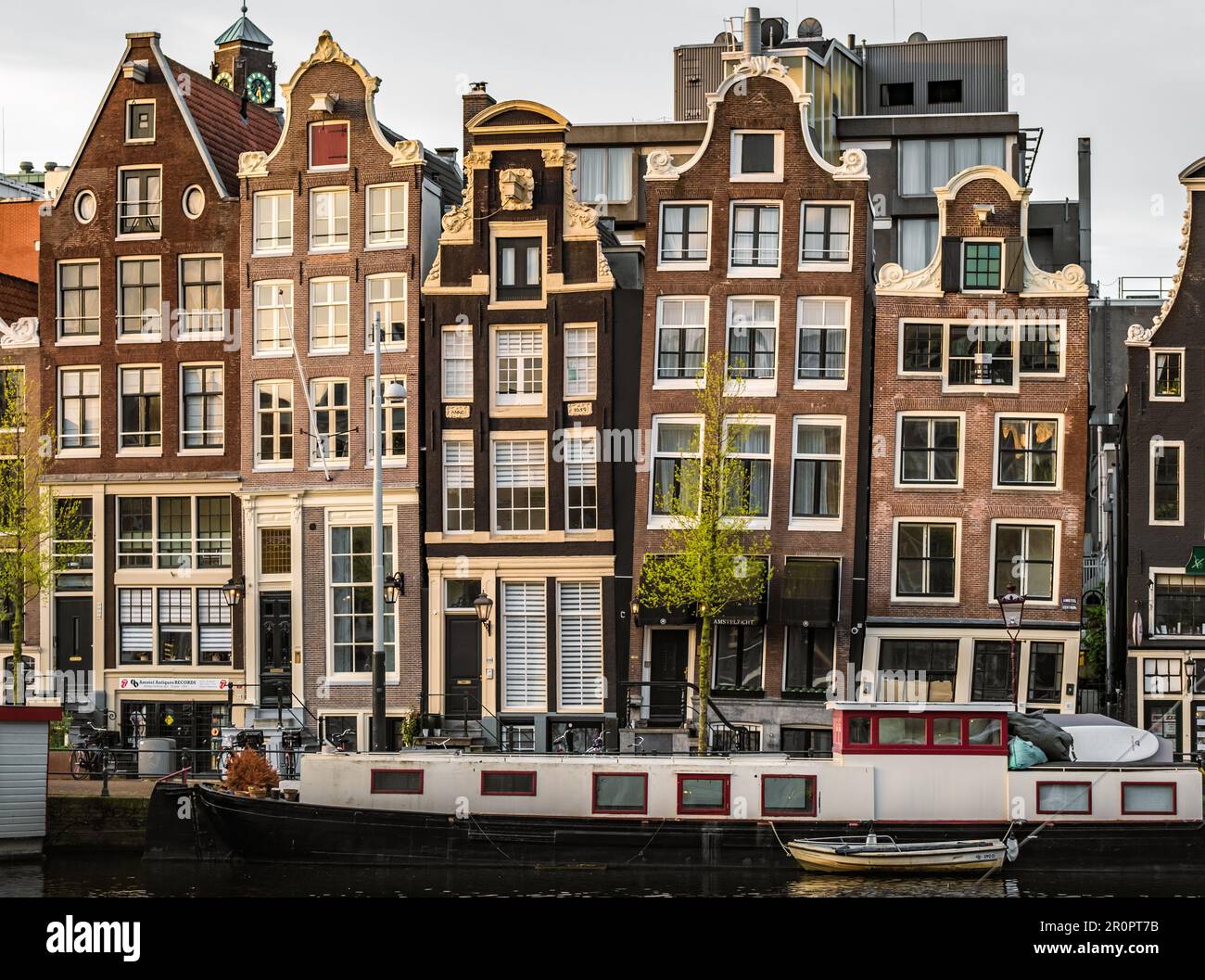 Famous and iconic Amsterdam houses under the morning sky. Various ...