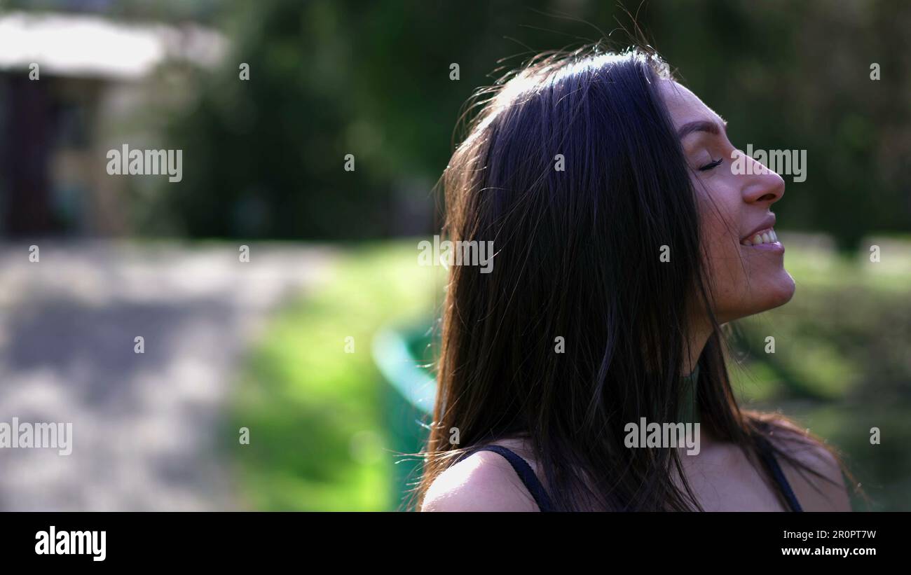 One hopeful Arab adult girl looking up at sky with Faithful gaze ...