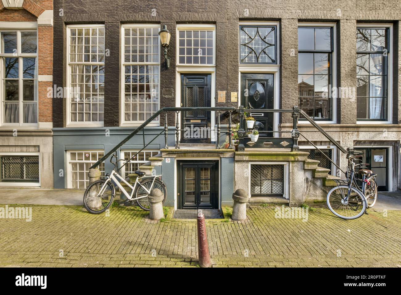 a bicycle parked on the side of a street in front of a building with ...
