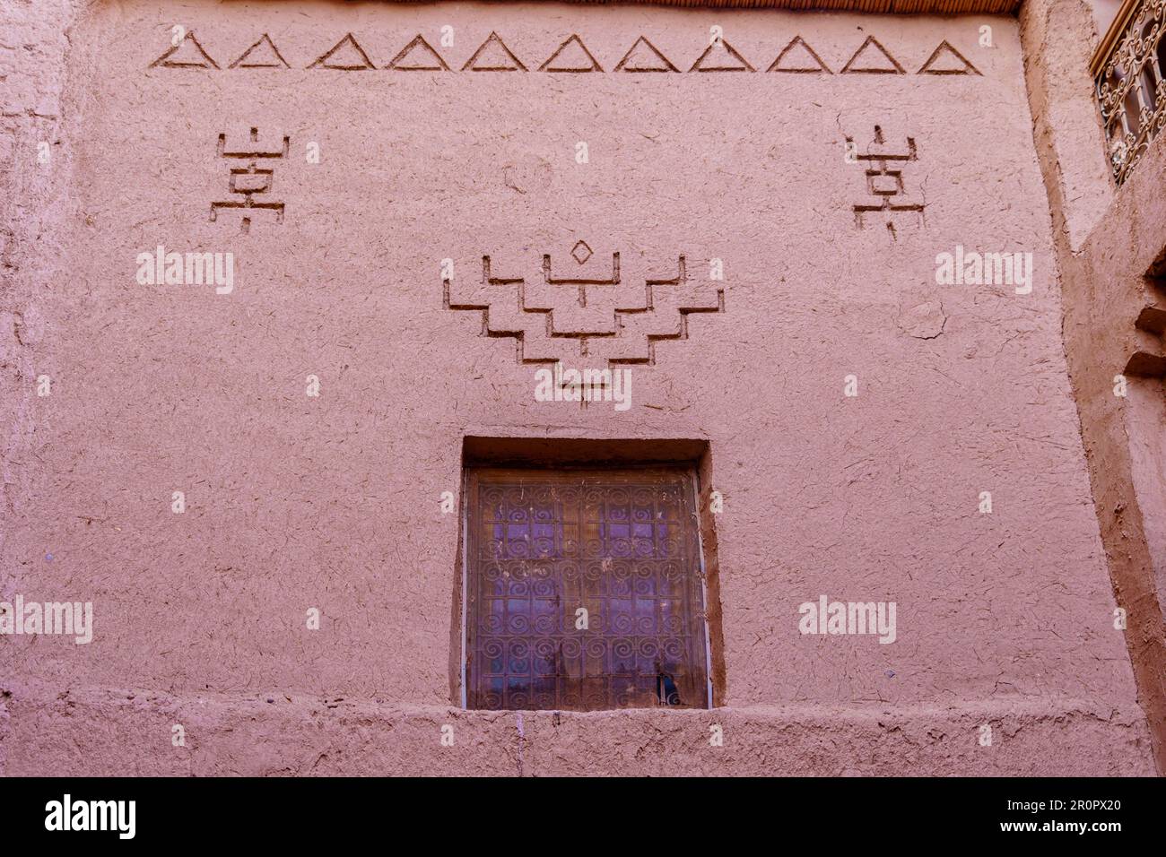 View of traditional Berber carvings, on historic old mud buildings, in ...