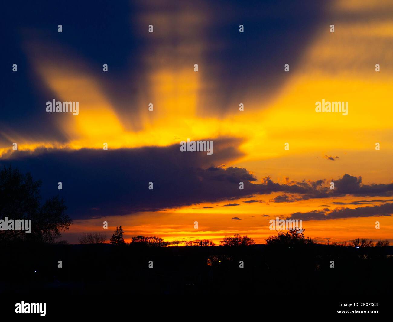 Sunset over Lake Mendota in Madison, WI. Cloudy skies with sun beams ...