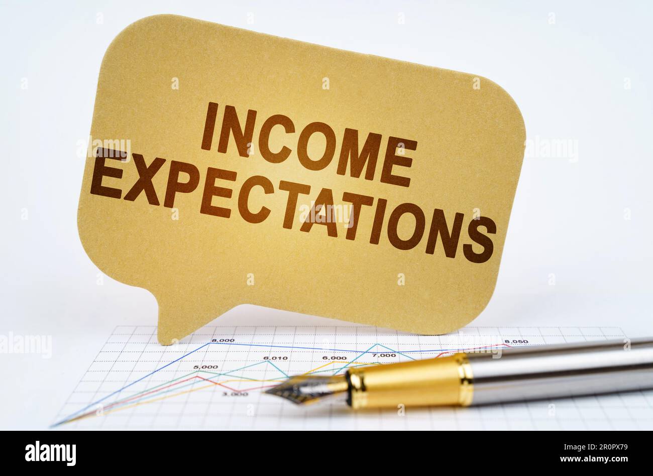 Business concept. On the business diagram is a pen and a sign with the ...