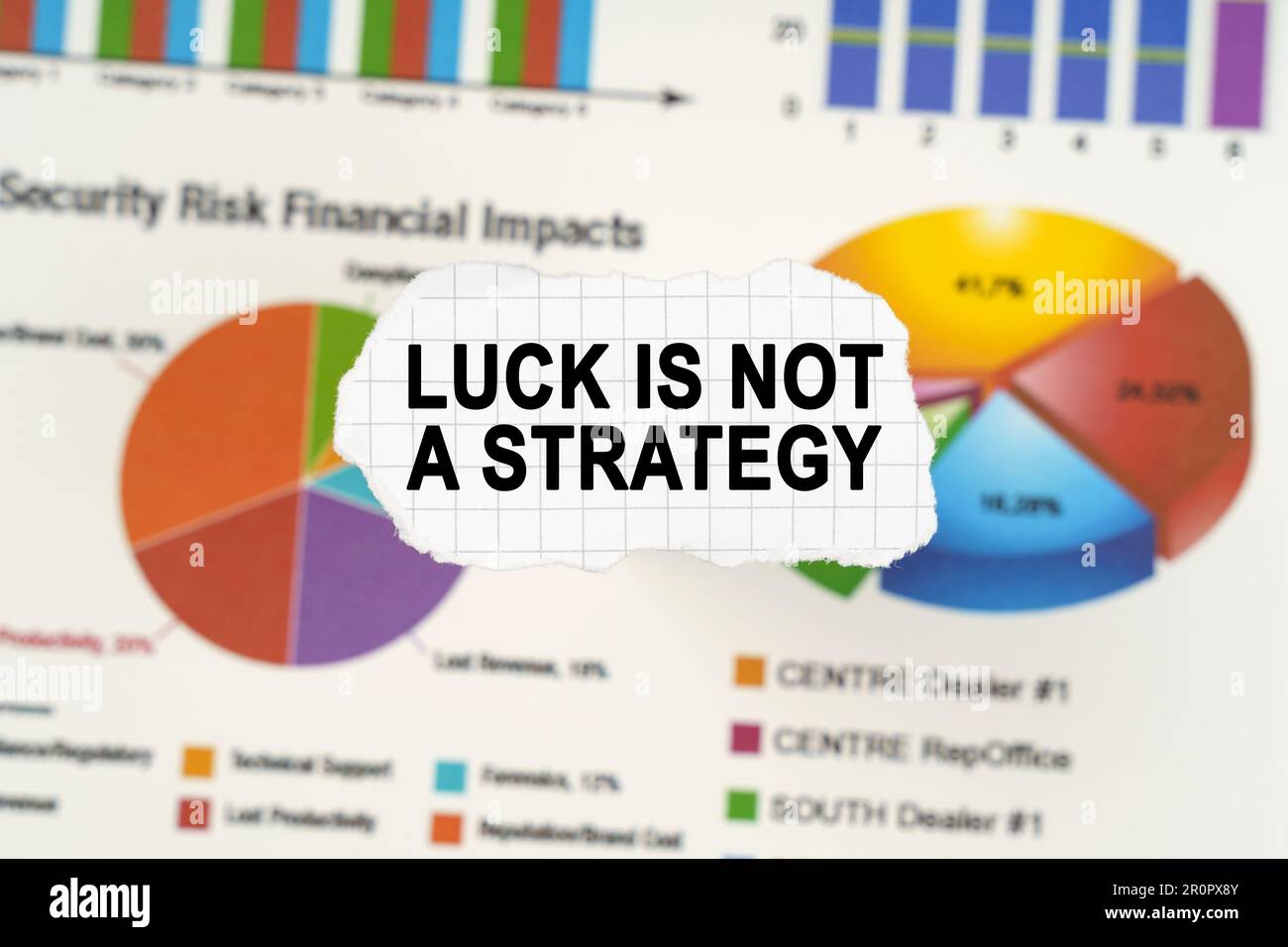 Business concept. On diagrams and graphs lies torn paper with the ...