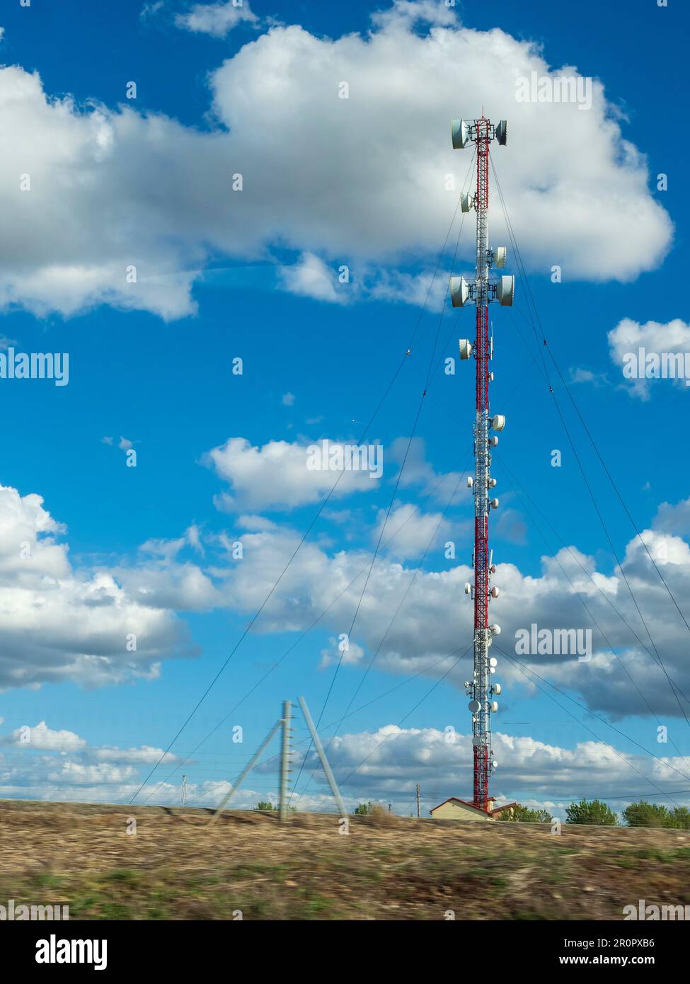 Landscape of road with communication tower Stock Photo - Alamy