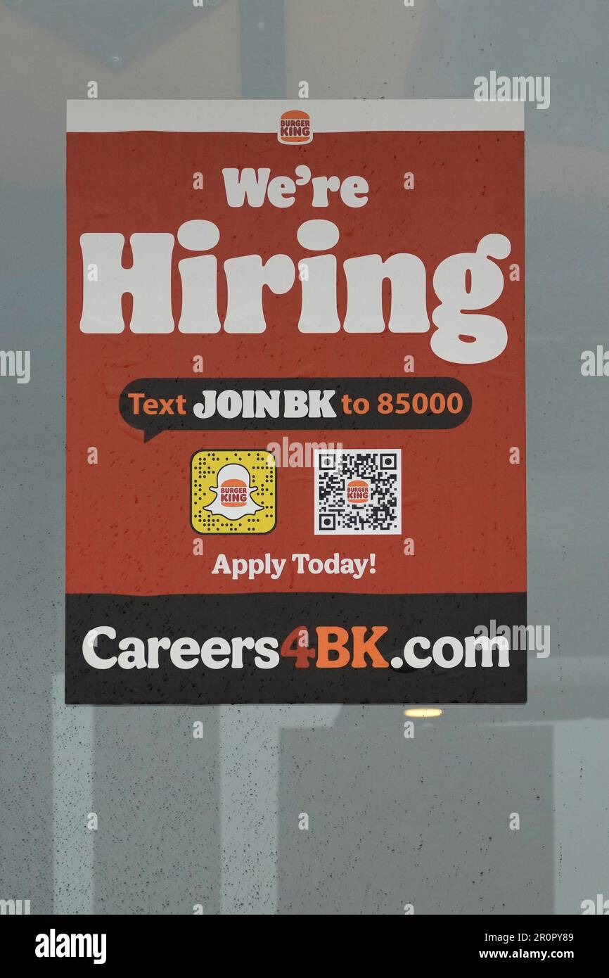 Hiring sign is displayed at a Burger King in Downers Grove, Ill., Monday, May 1, 2023. (AP Photo ...