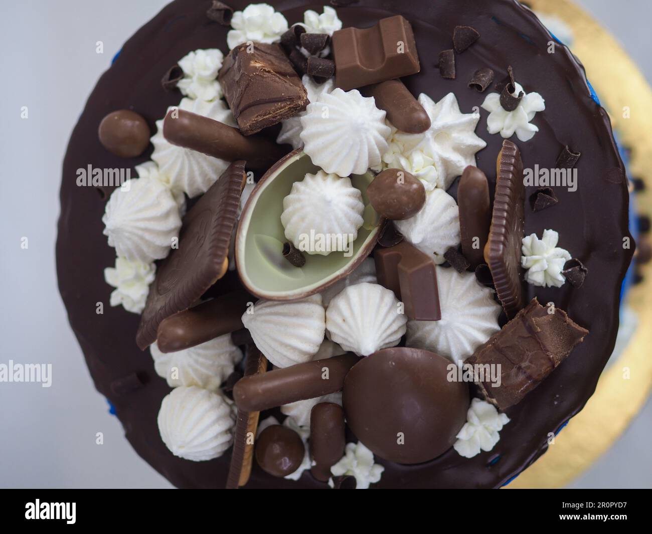 blue frosted icing cake macro close up with dark chocolate icing and ...