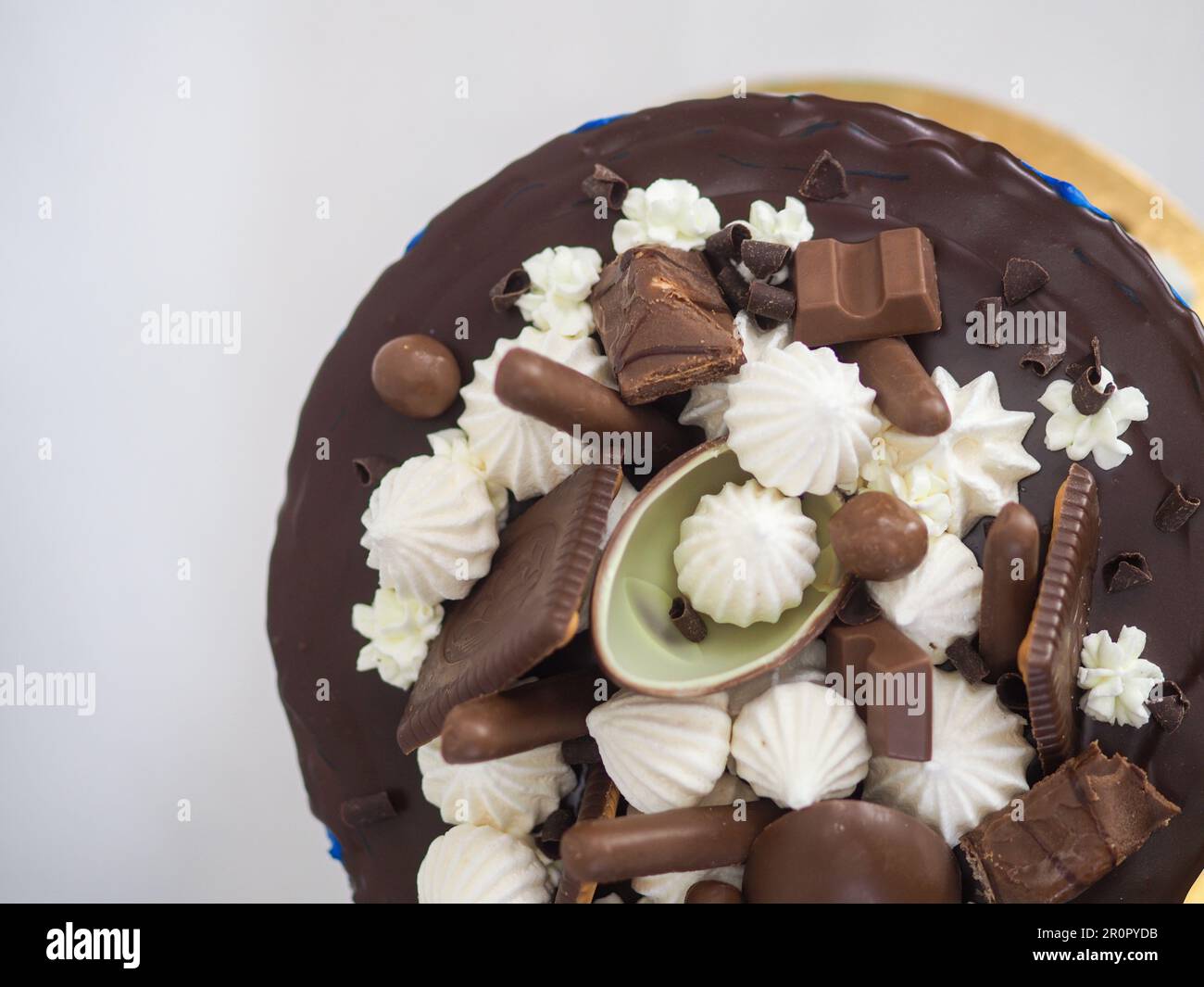 blue frosted icing cake macro close up with dark chocolate icing and ...