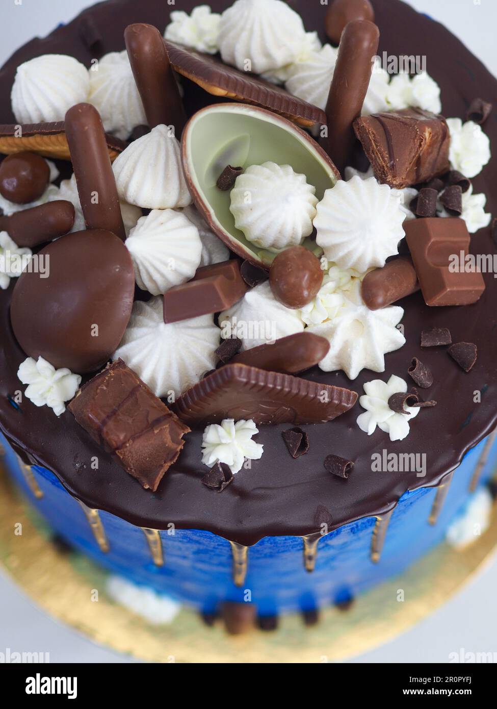 blue frosted icing cake macro close up with dark chocolate icing and ...