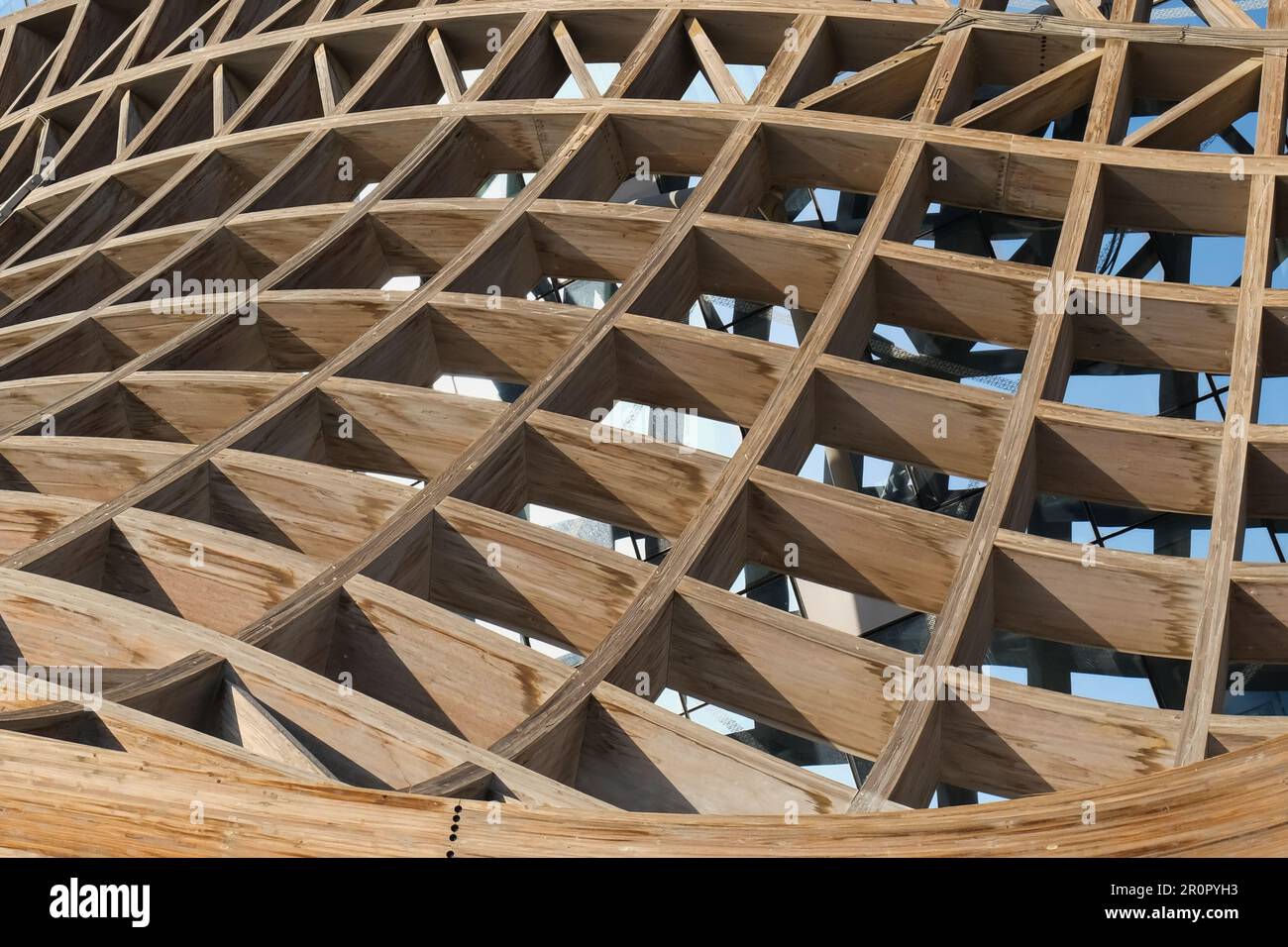 Abstract curved wooden framed sections of decorative wall or shade roof ...