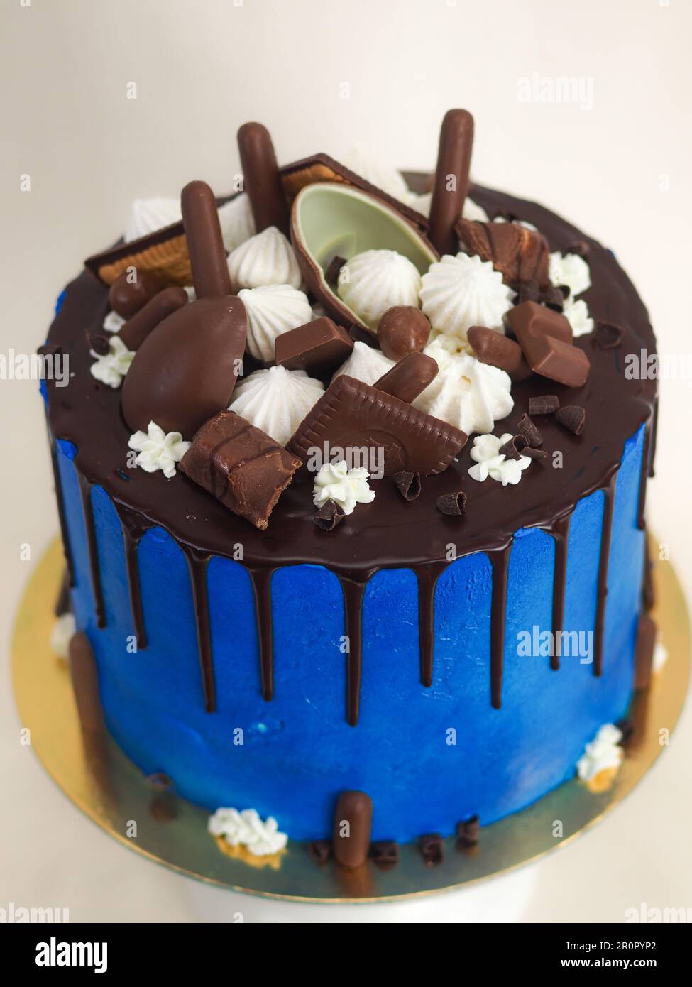 blue frosted icing cake macro close up with dark chocolate icing and ...