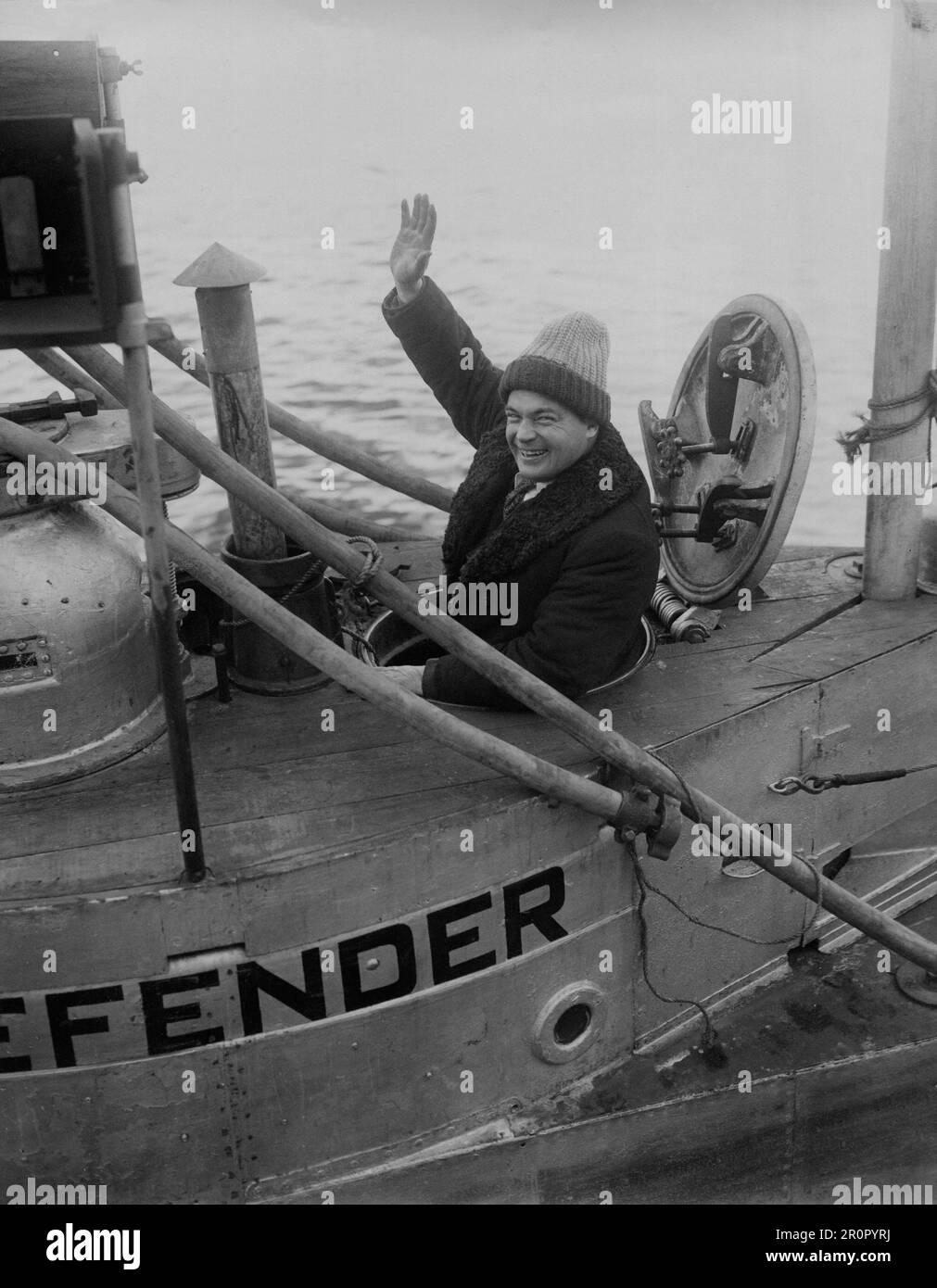 Captain Sloan Danenhower waves from the hatch of the submarine ...