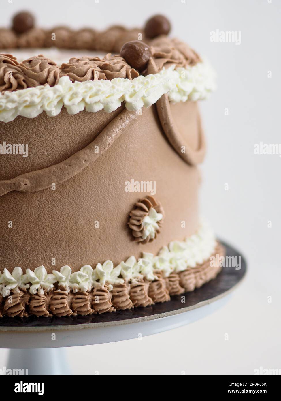 elegant beige brown frosted icing cake macro close up isolated on white ...
