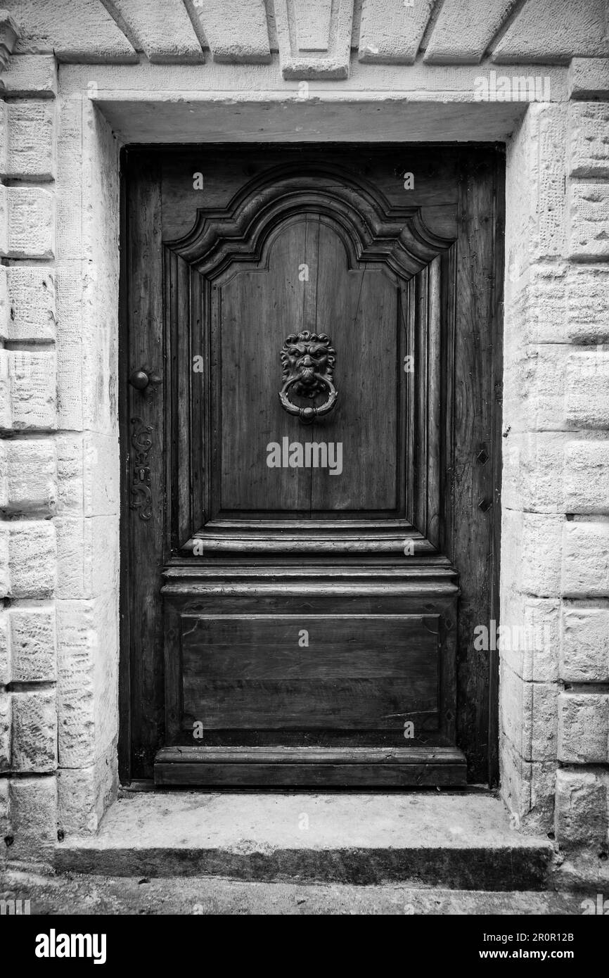 Wooden door with door knocker Black and White Stock Photos & Images - Alamy